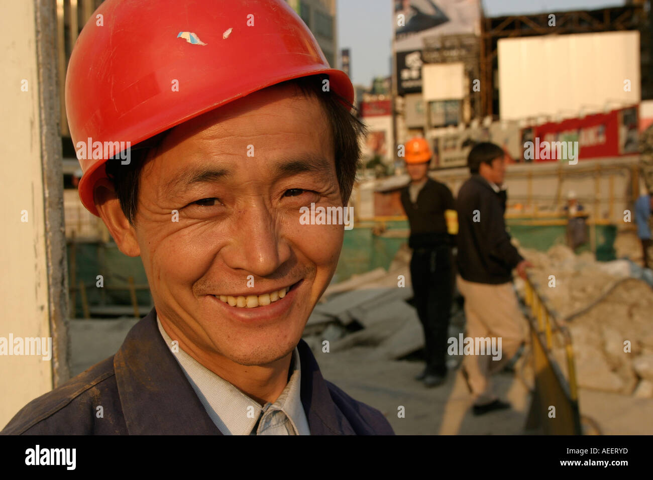Shanghai, China. Construction workers completing road works on Xizang ...