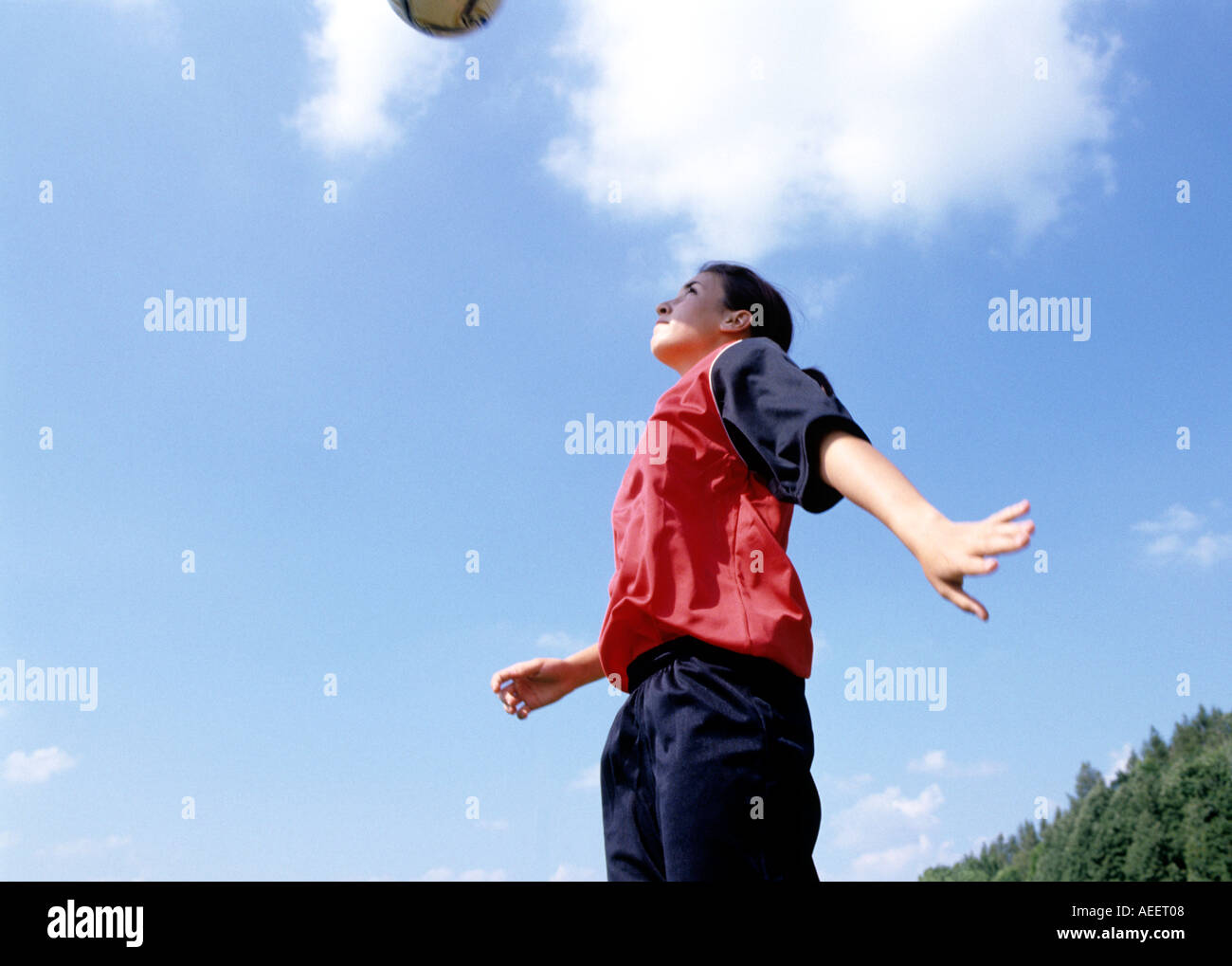 Girl heading football hi-res stock photography and images - Alamy