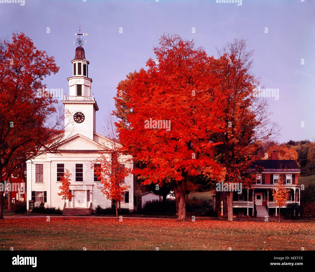 Chelsea in Vermont showing village church surrounded by flaming red ...