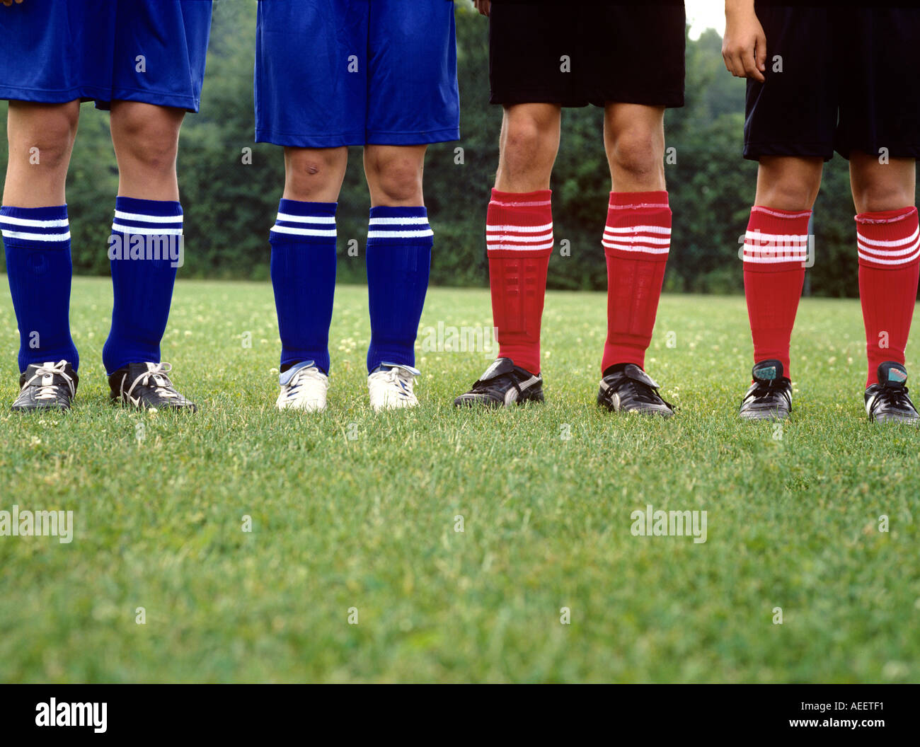 four football players standing in line Stock Photo - Alamy