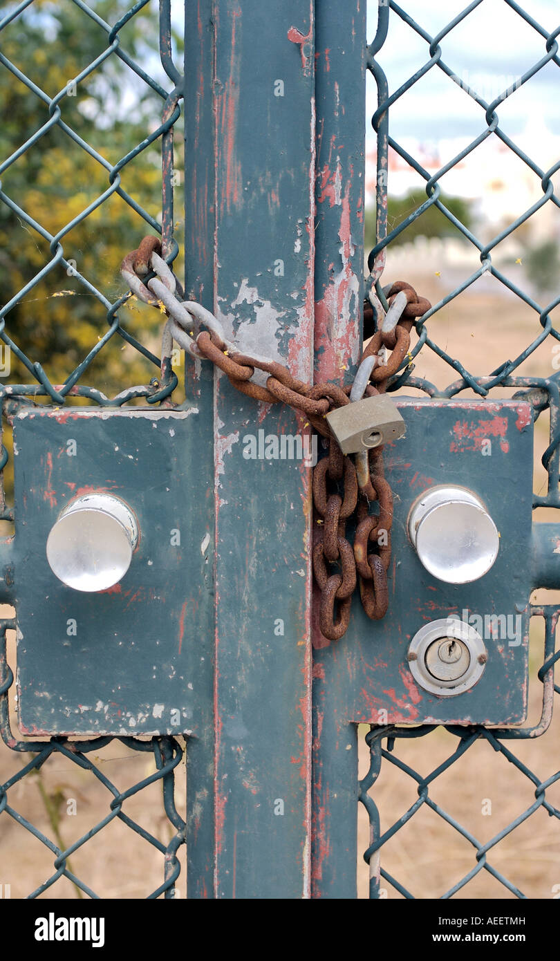 steel padlocked gates with chain Stock Photo - Alamy