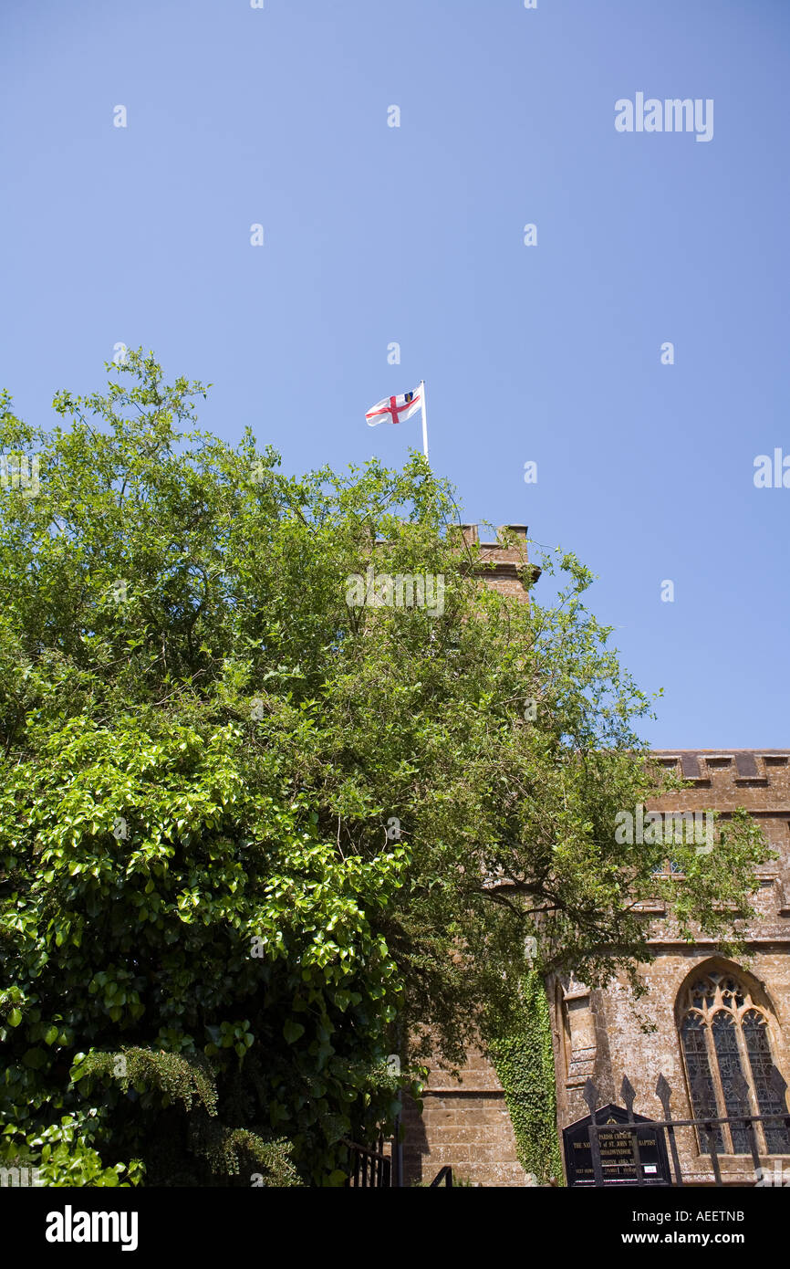 English Flag flies proudly over the Church of St John the Baptist ...