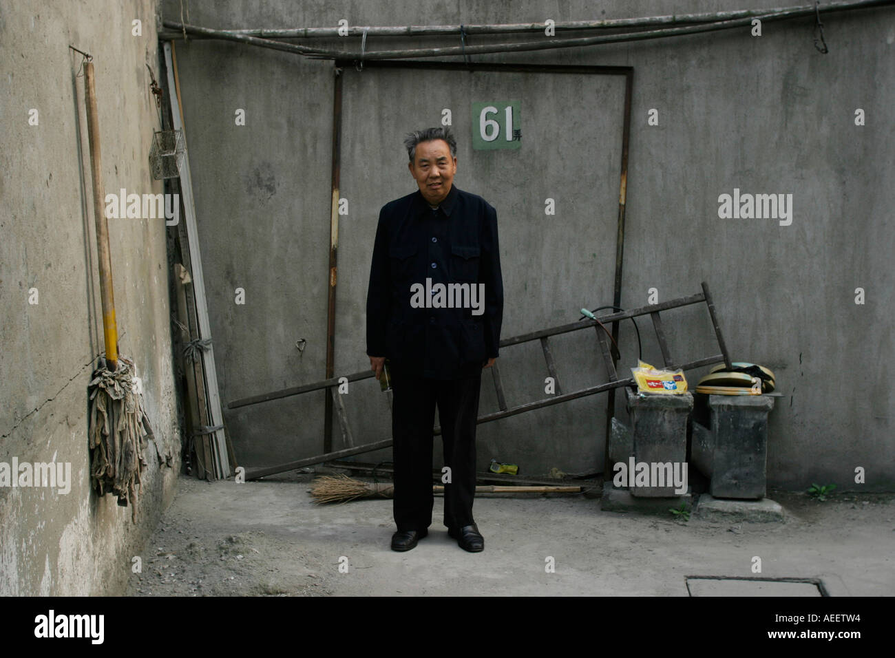 Shanghai China A man stands at the corner of a street shortly to be ...