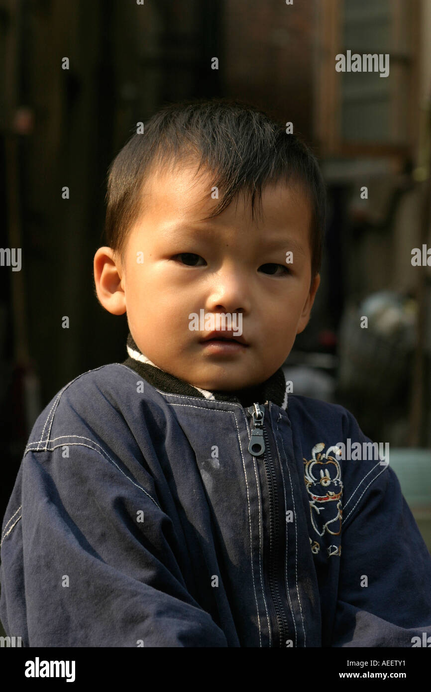 Shanghai China A young boy outside his home in the backstreets of ...