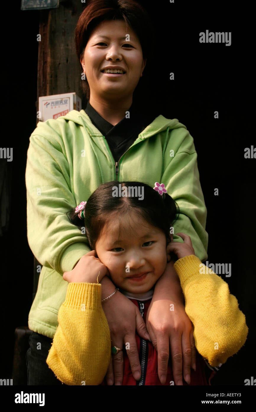 Shanghai China 8 year old girl Zeng Ting with her mother by her home in ...
