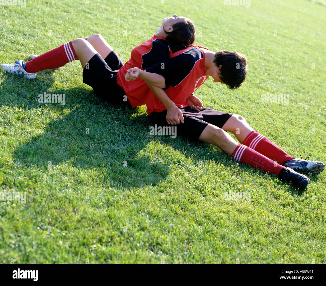 young football players doing stretching exercises Stock Photo - Alamy