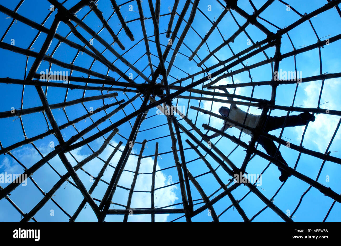 Roof structure of Iron Age roundhouse being built using traditional ...