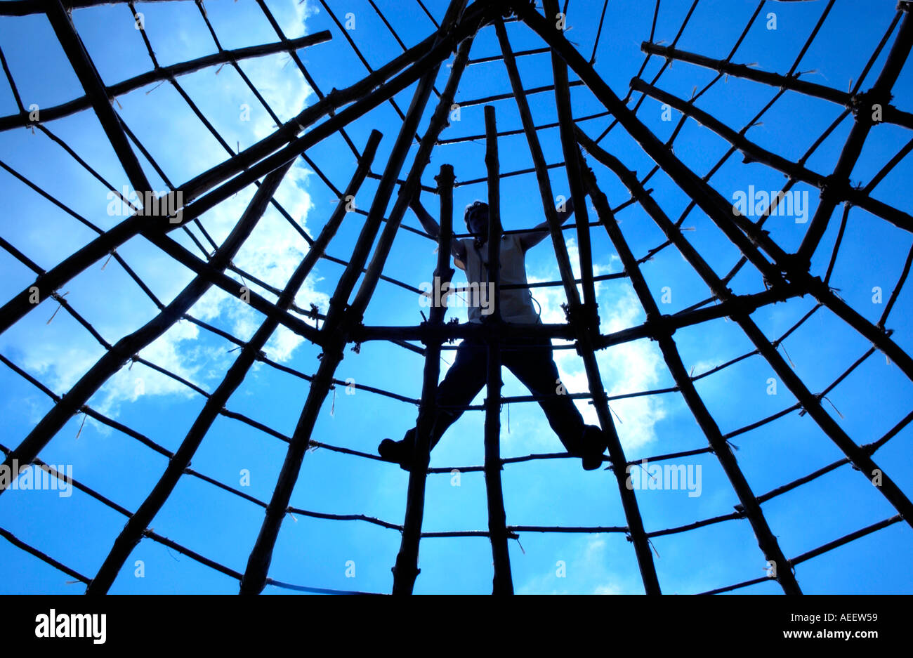 Roof structure of Iron Age roundhouse being built using traditional ...