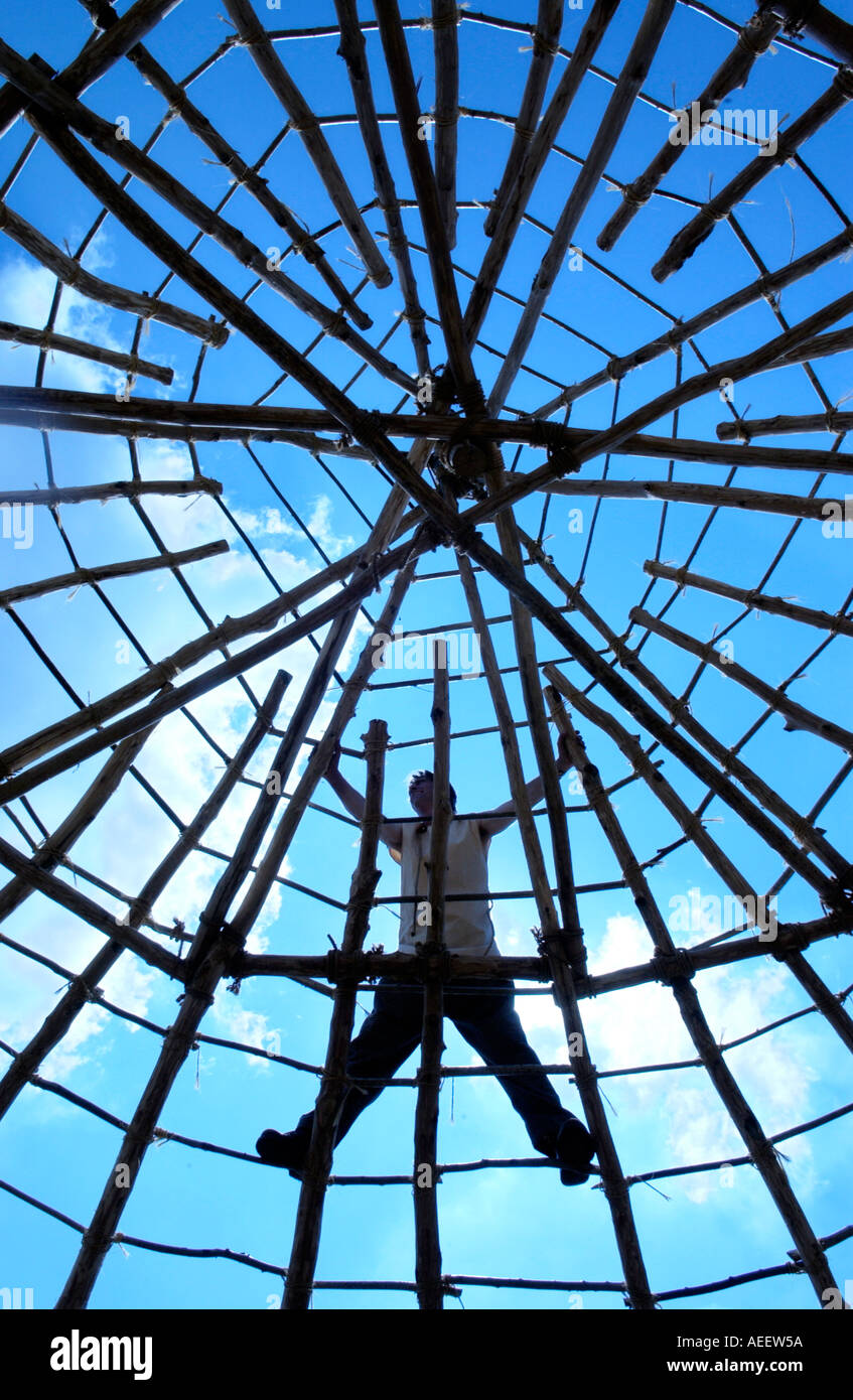 Roof structure of Iron Age roundhouse being built using traditional ...
