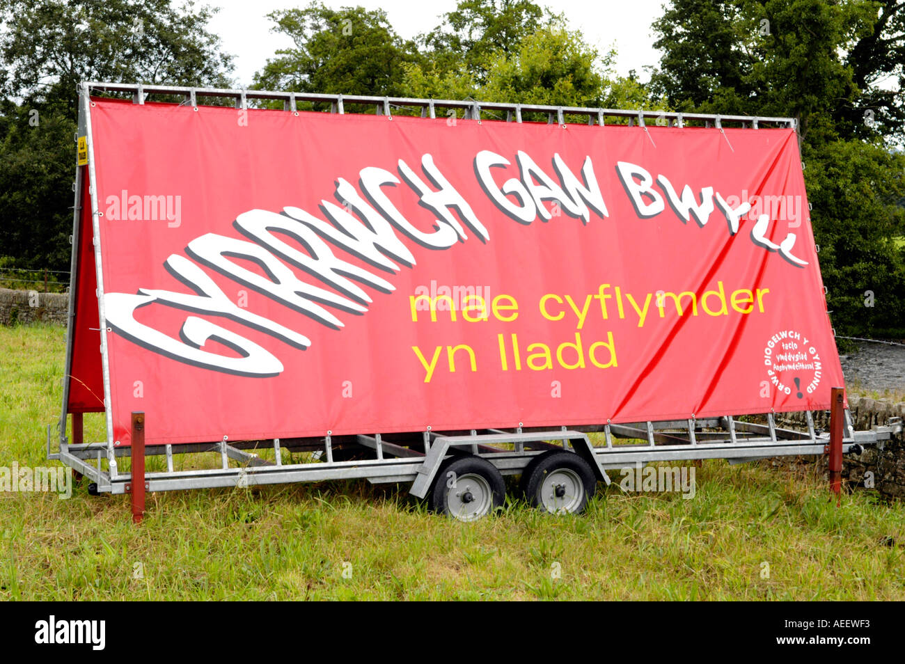 Welsh language roadside mobile sign saying KILL YOUR SPEED SPEED KILLS ...