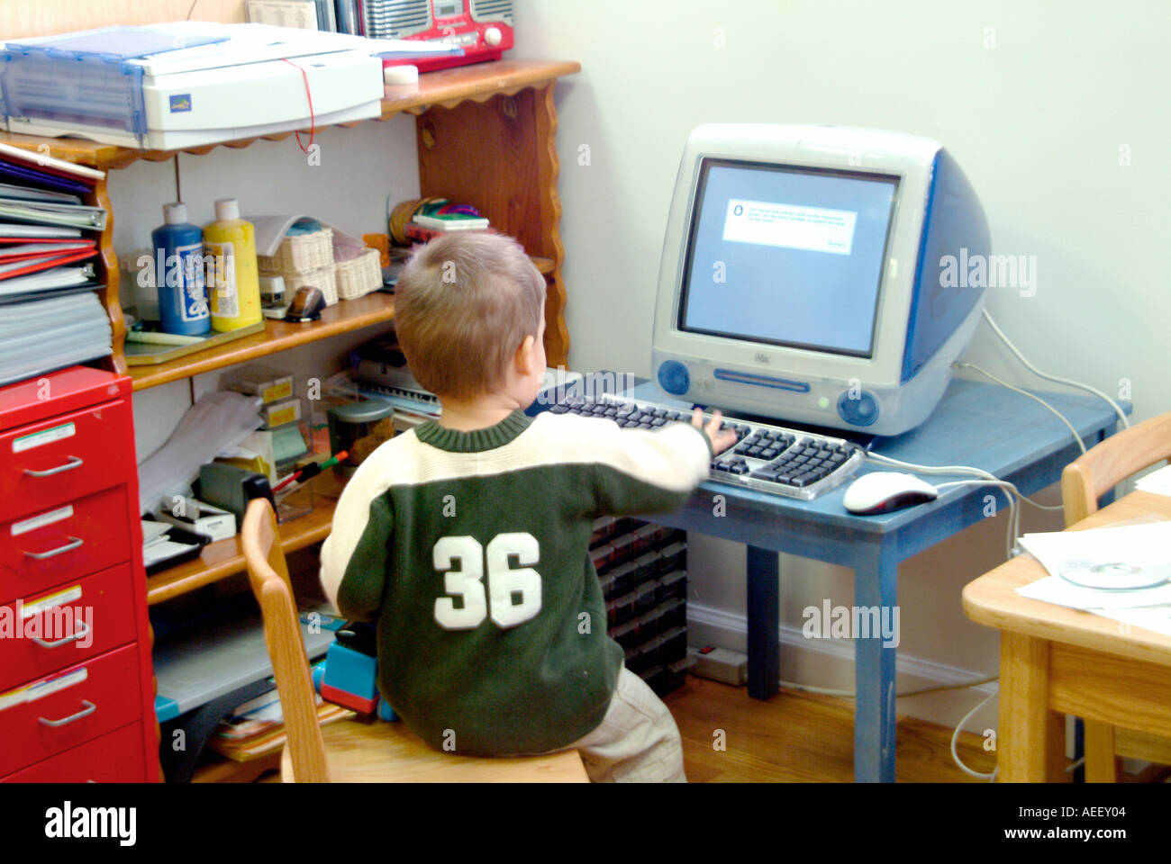Little boy in front of computer in preschool Stock Photo - Alamy