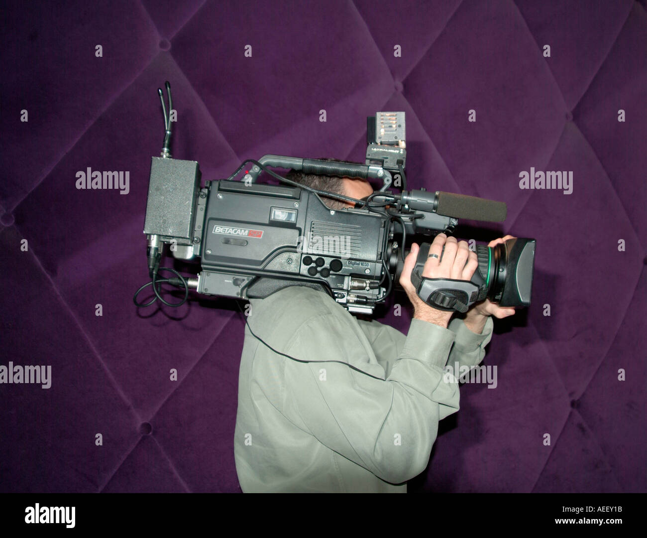 Cameraman filming an event Stock Photo - Alamy