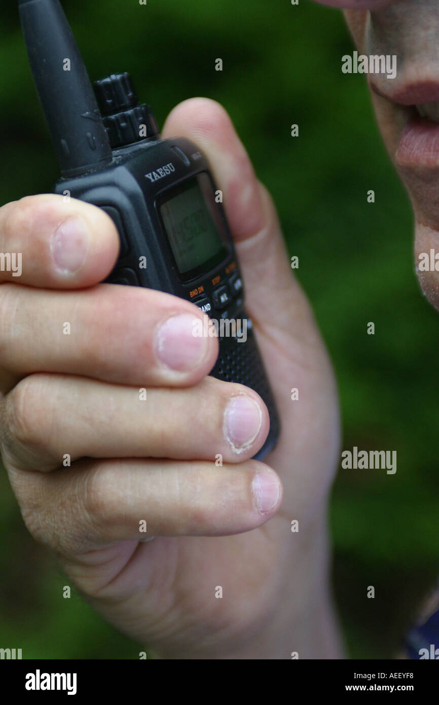 man using a two way communications radio Stock Photo - Alamy