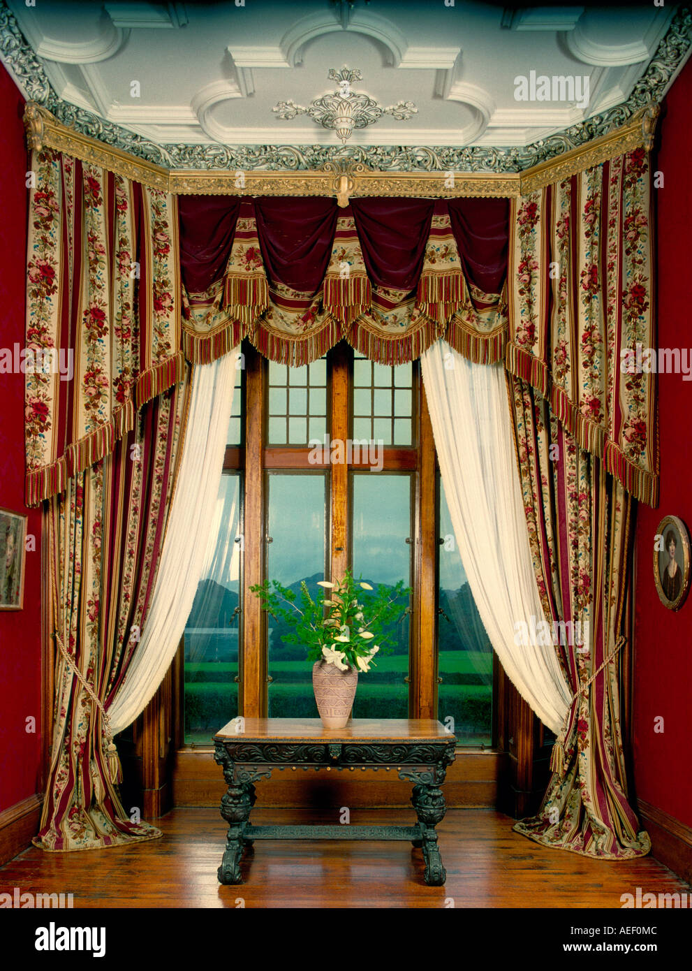A draped window in the Victorian stately home of Muckross House ...