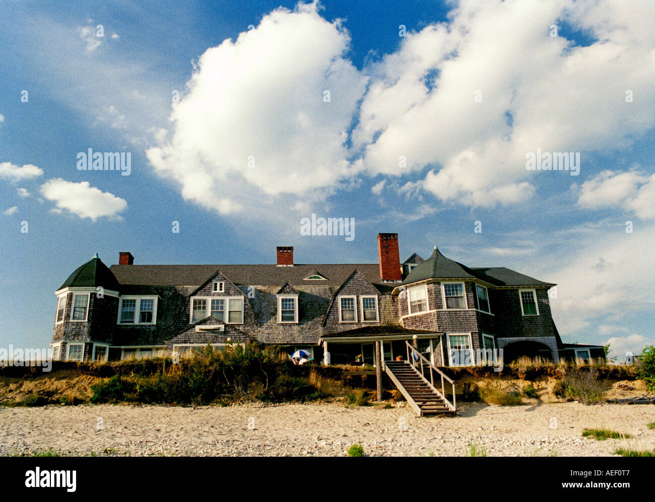 An old shingle-clad holiday home on the beach at Cape Cod ...