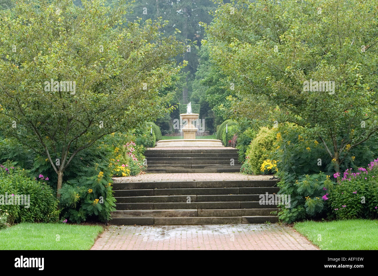 Sidewalk path through public gardens Stock Photo - Alamy