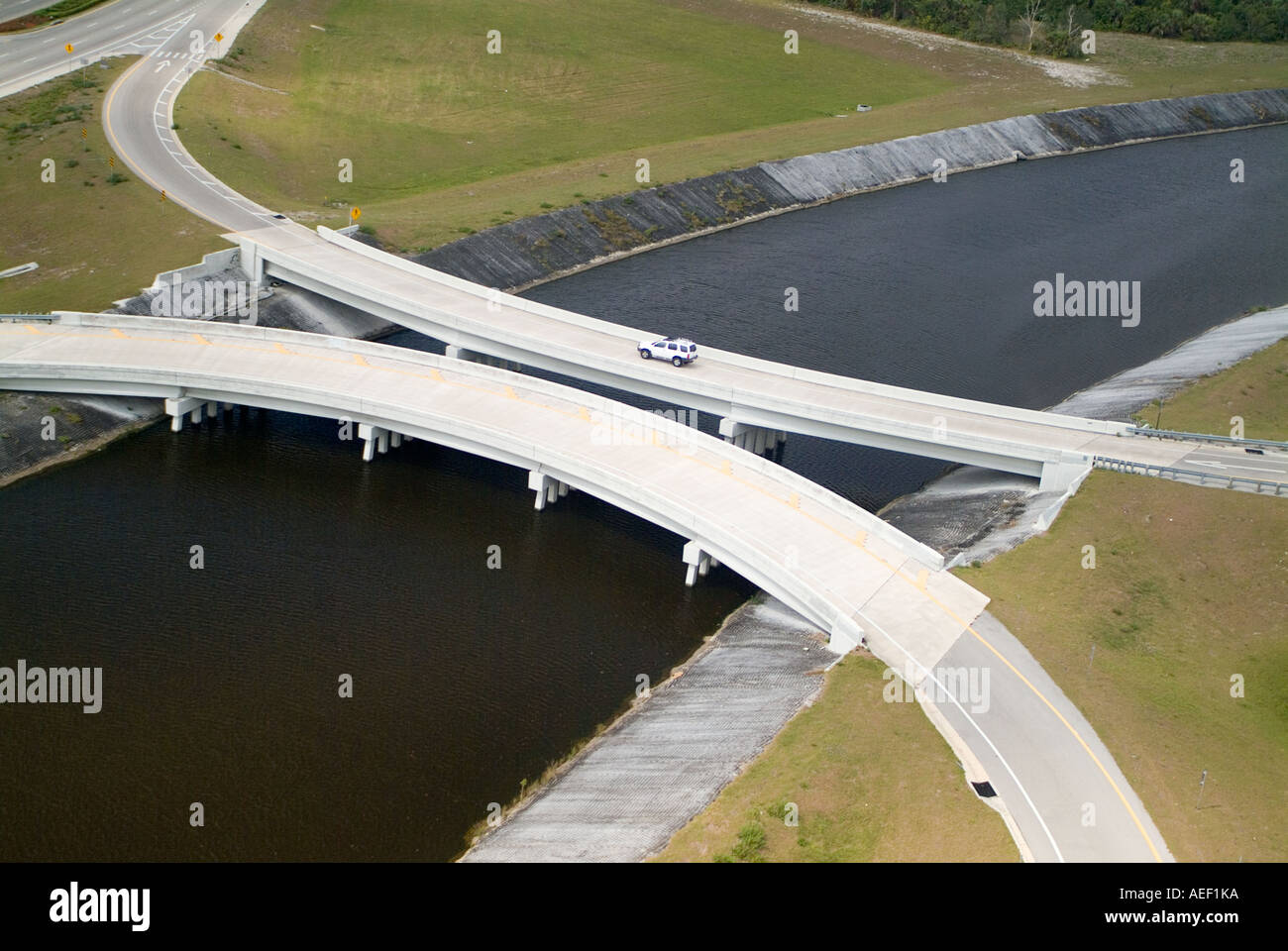 curved bridges over canal transportation roadway roads streets curving ...