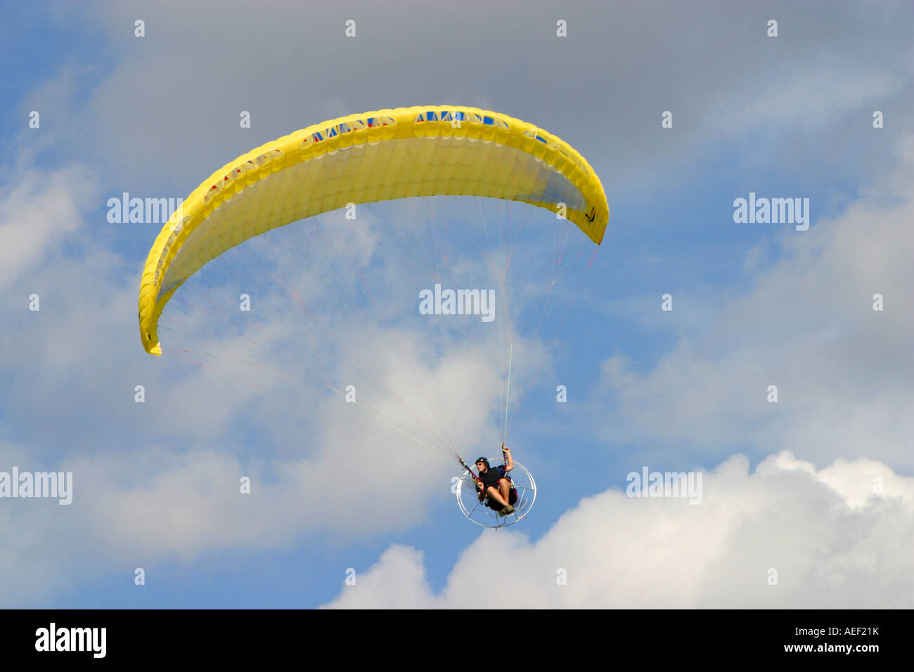 Powered paraglider in flight Stock Photo - Alamy