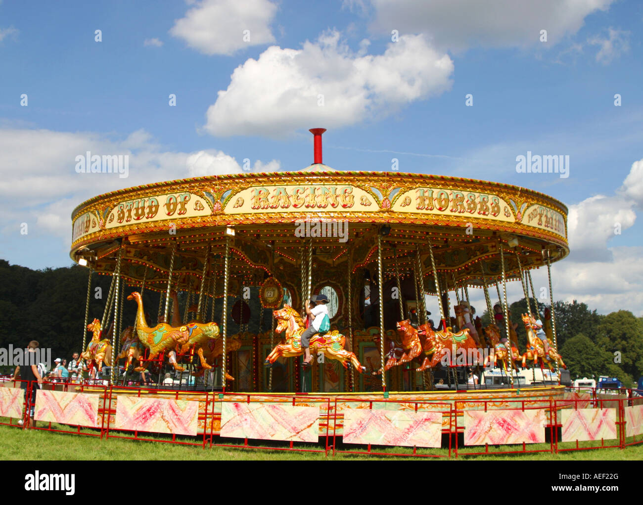 Traditional merry go round with horses hi-res stock photography and ...