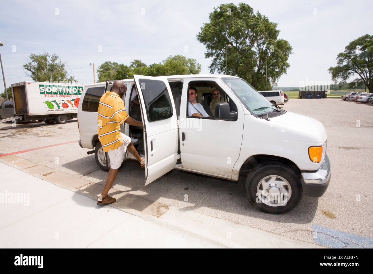 Inmate getting into van leaving facility to go on work detail Community ...