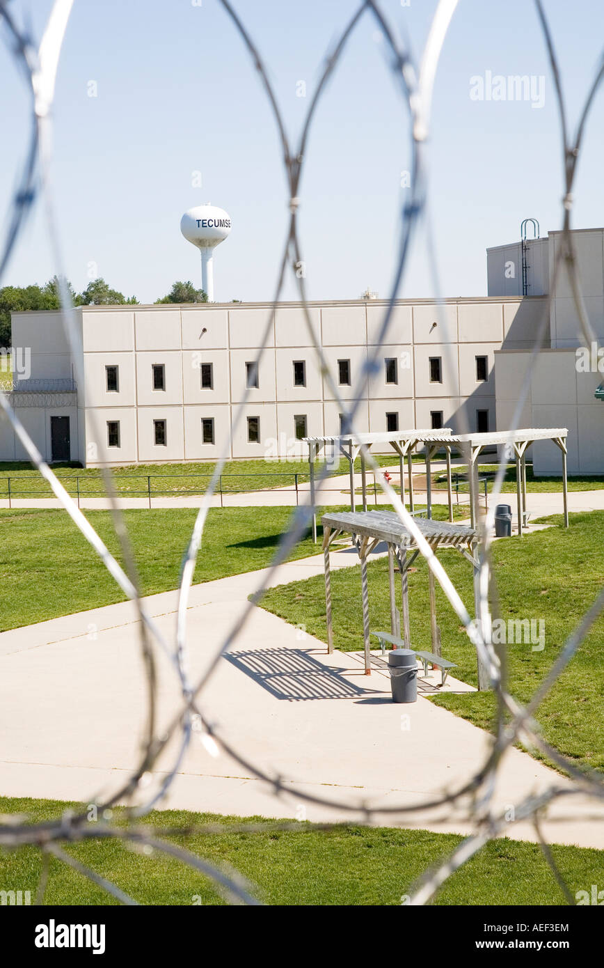 Housing units seen through razor-wire. Maximum Security prison ...