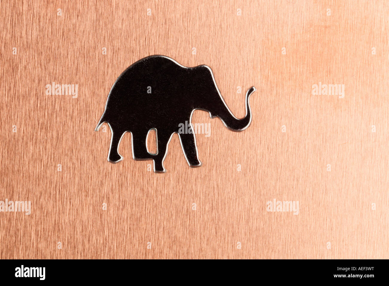 elephant shape on warm metallic surface Stock Photo - Alamy