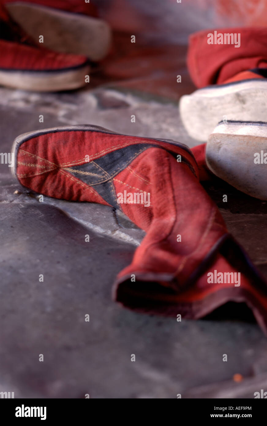Monk's red shoes at Tashilhunpo Monastery Stock Photo - Alamy