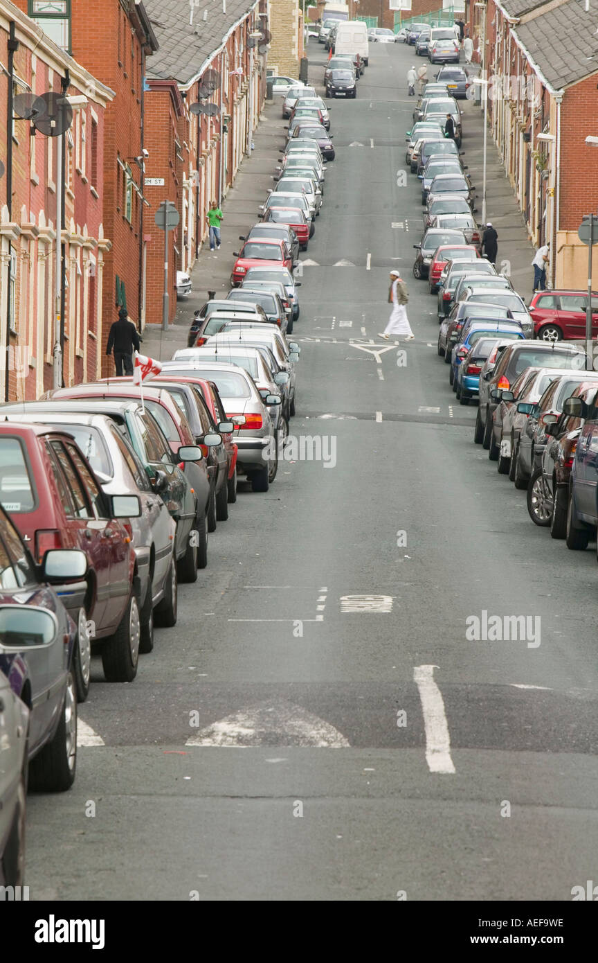 cars parked on an overcrowded street in a muslim area of Blackburn ...