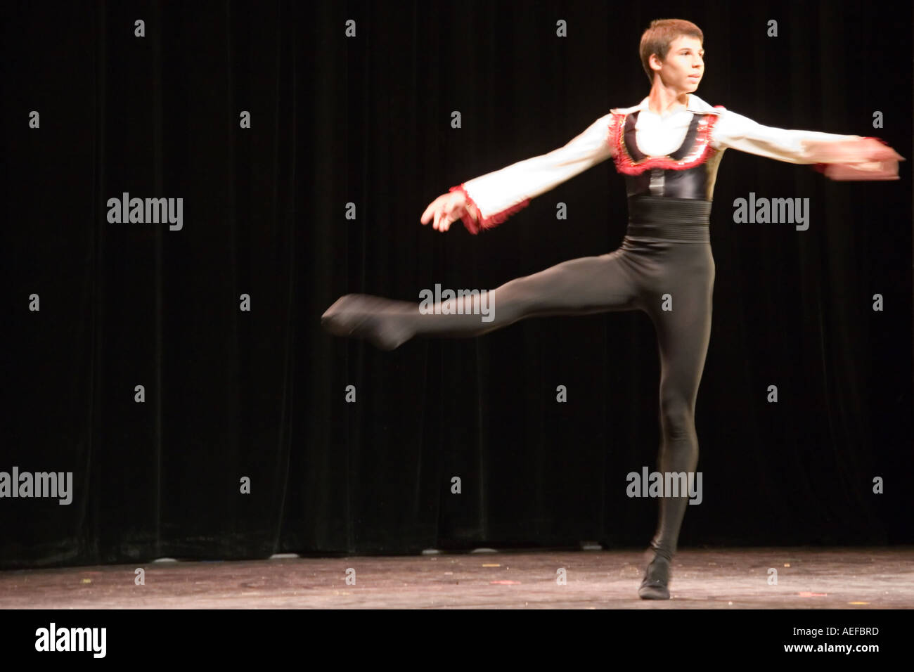 Stock photo of male ballet dancer spinning in a performance on stage ...