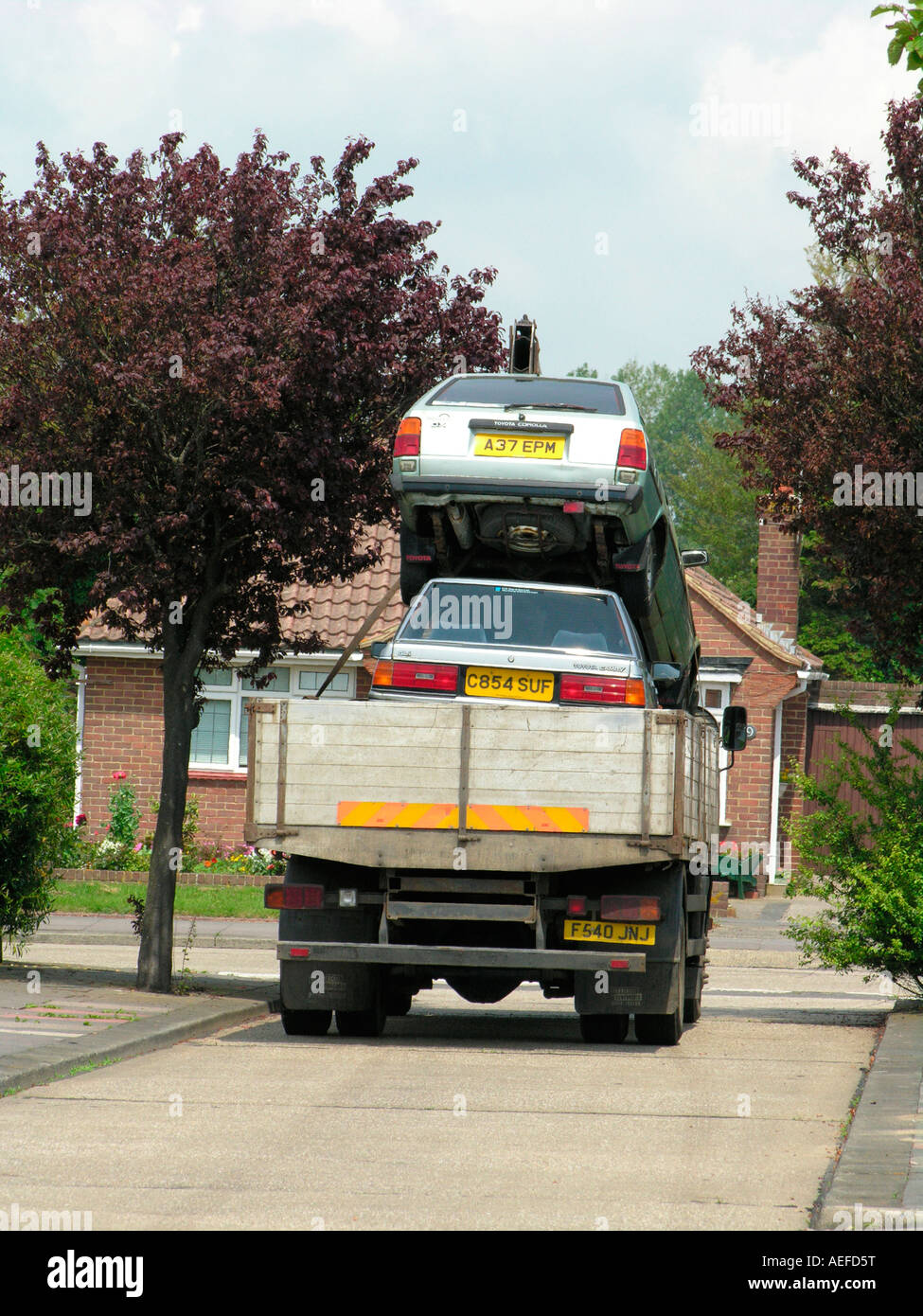 lorry collecting scrap cars Stock Photo - Alamy