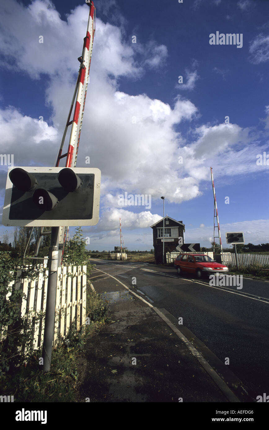 car passing open level crossing and signal box at thorpe willoughby ...