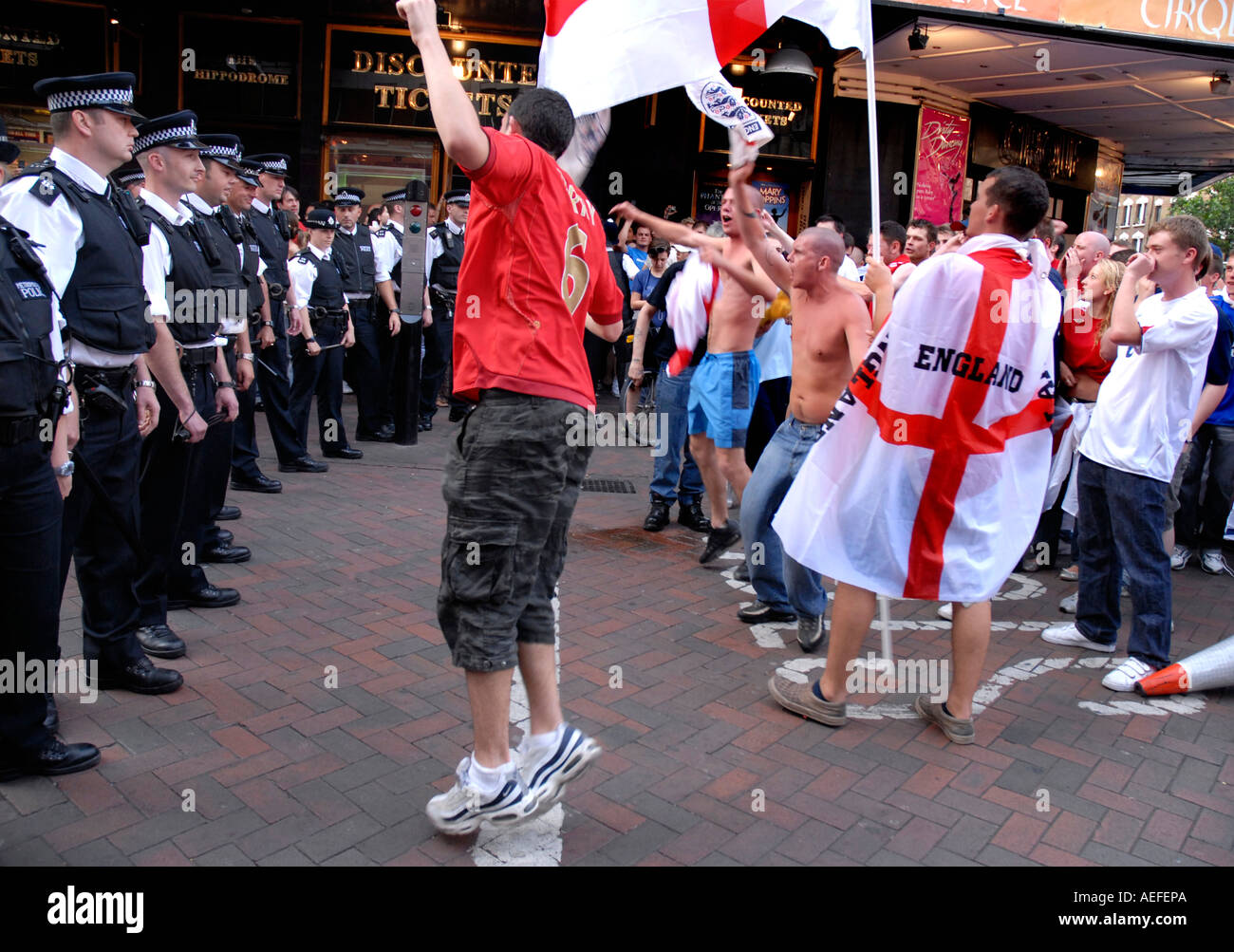 Group of football fans taunting the police in Central London after ...