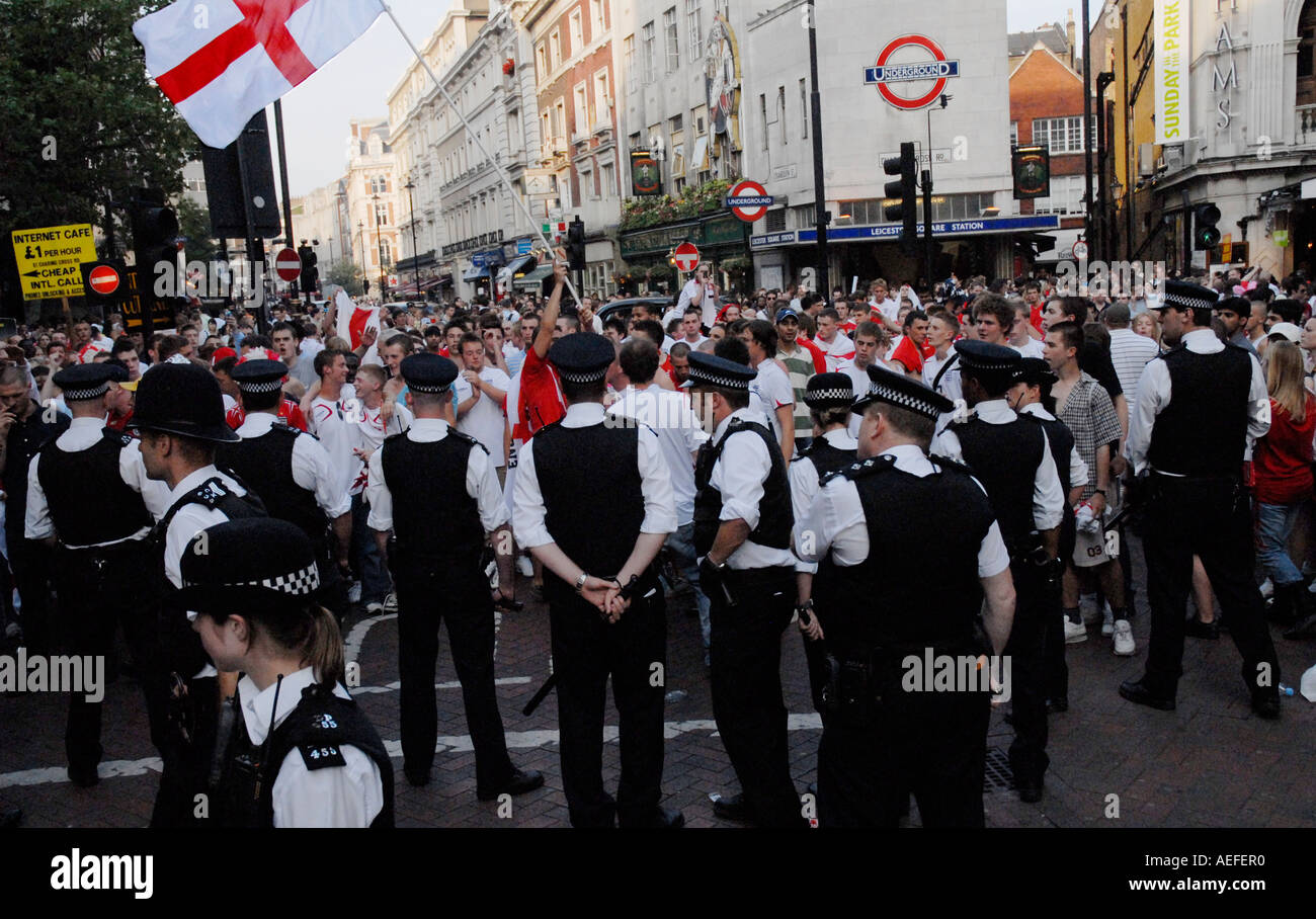 Group of football fans taunting the police by Leicester Square in ...