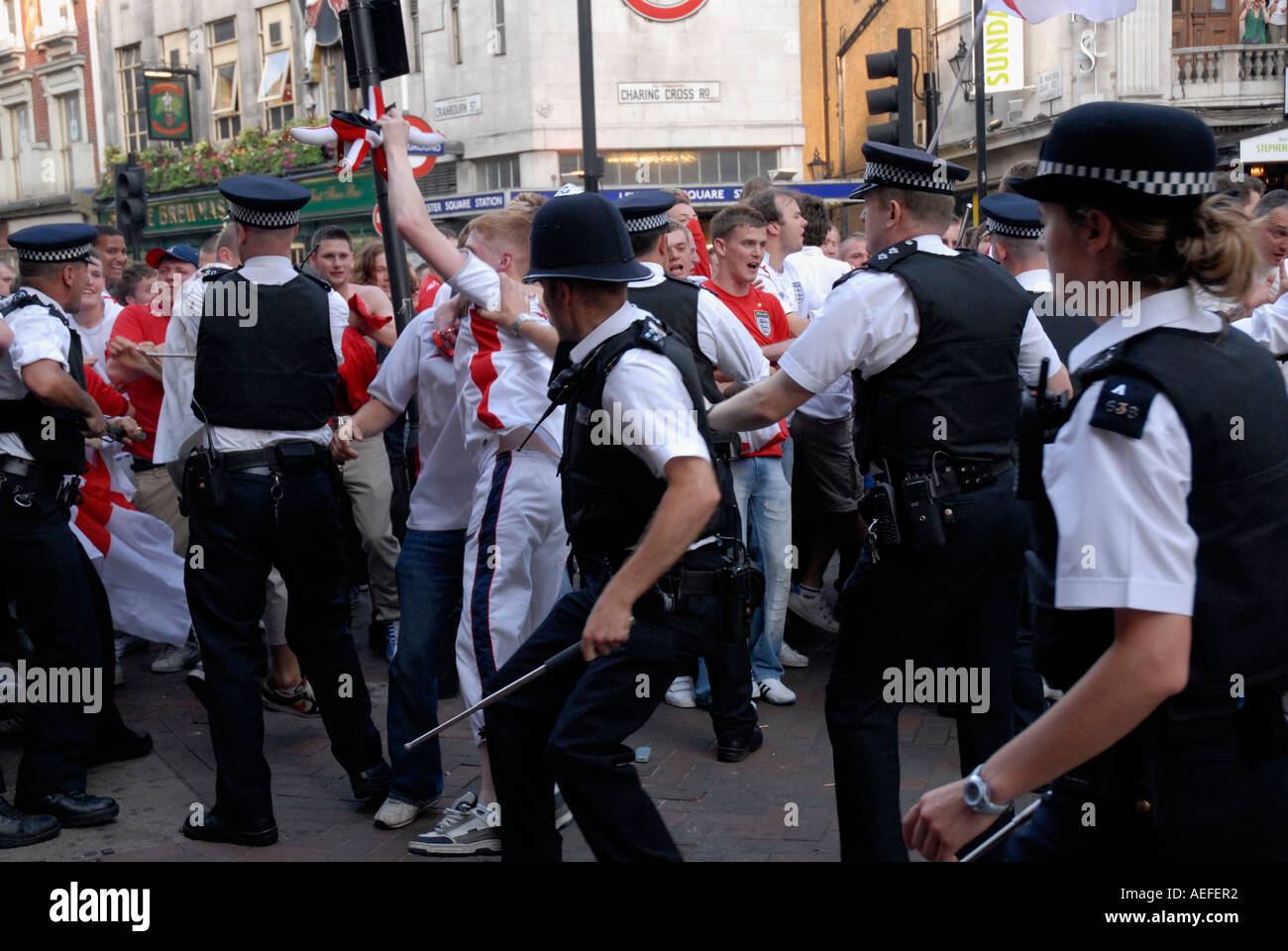 Police repel football fans taunting Leicester Square Central London ...