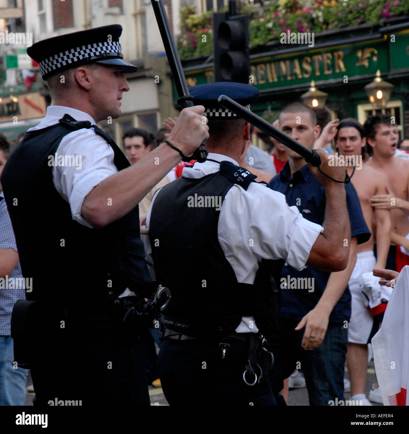 Police repel football fans taunting Leicester Square Central London ...