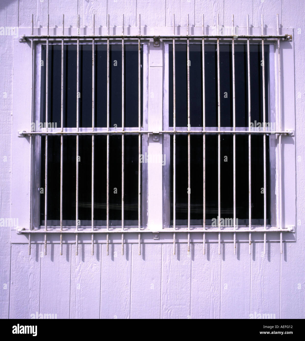 Window with bars in front Stock Photo - Alamy