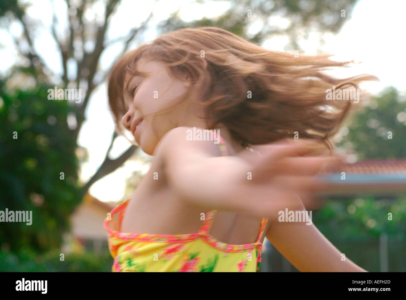 Little girl spinning Stock Photo - Alamy