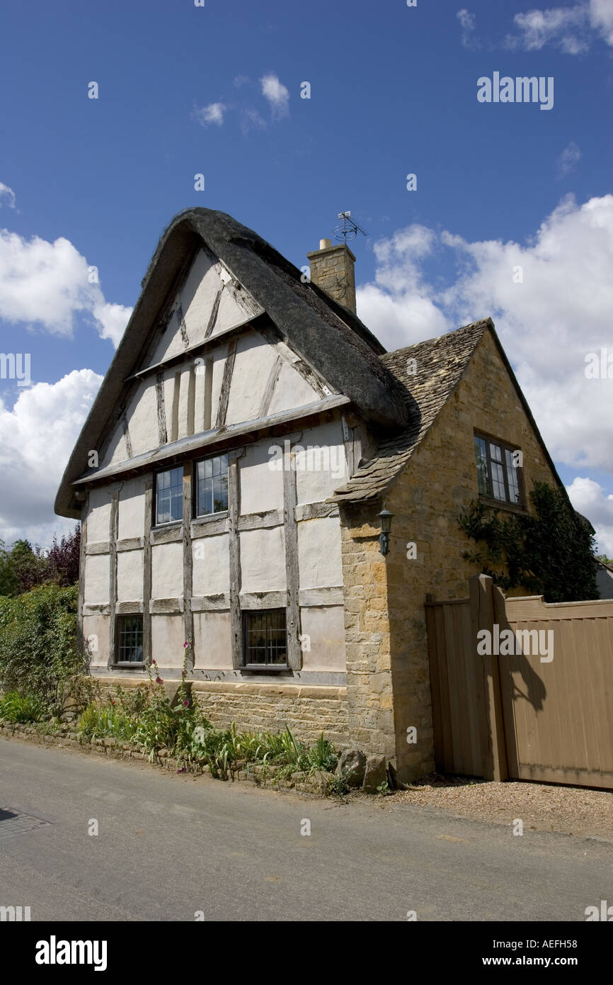 Thatched half timbered Cotswold house in the village of Stanton ...