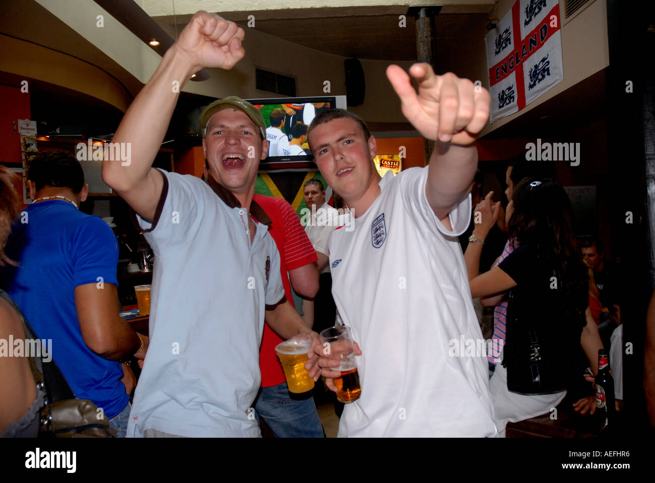 Sport football fans supporters celebrating football shirts drinking ...
