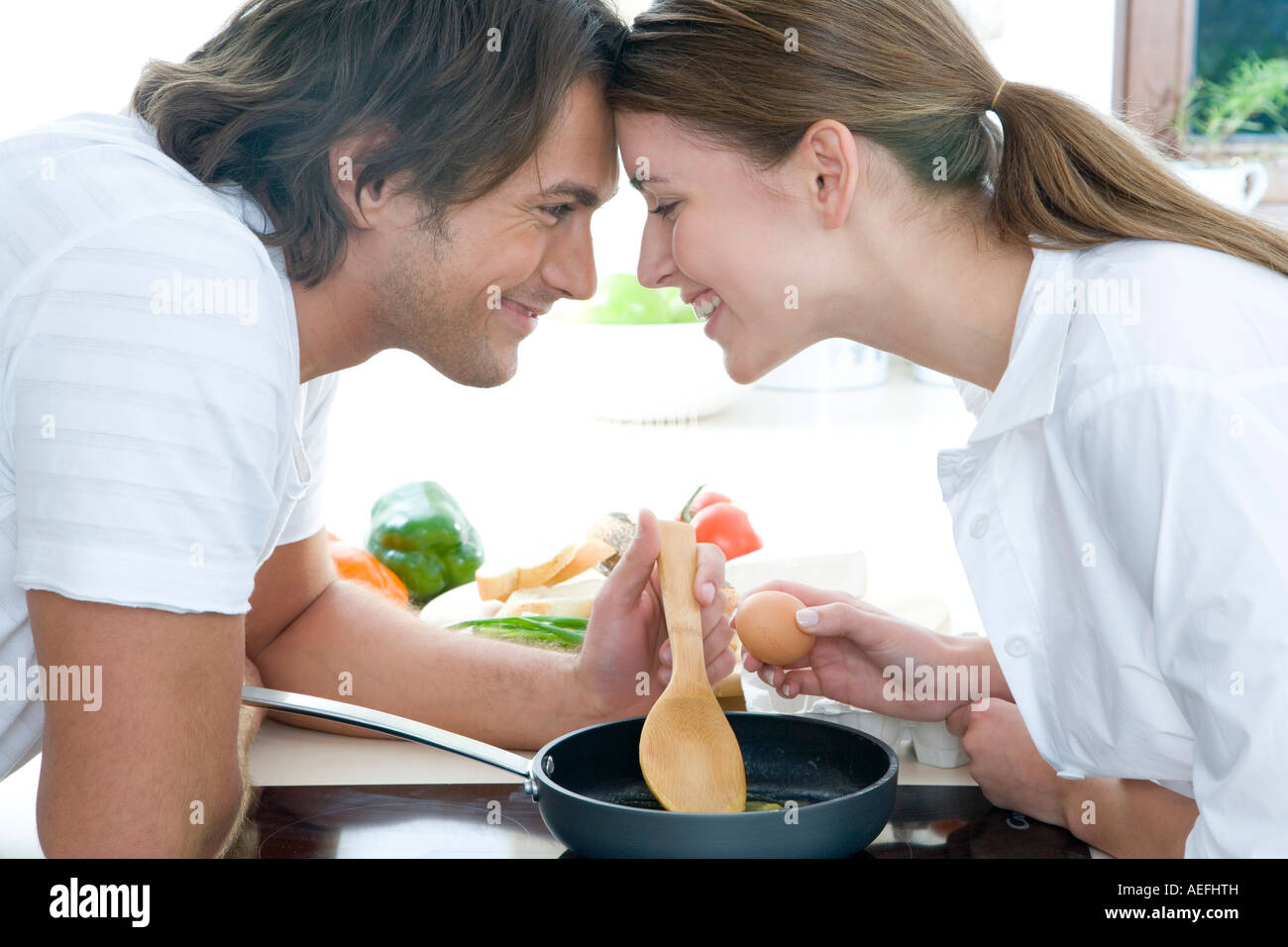 couple making breakfast Stock Photo - Alamy
