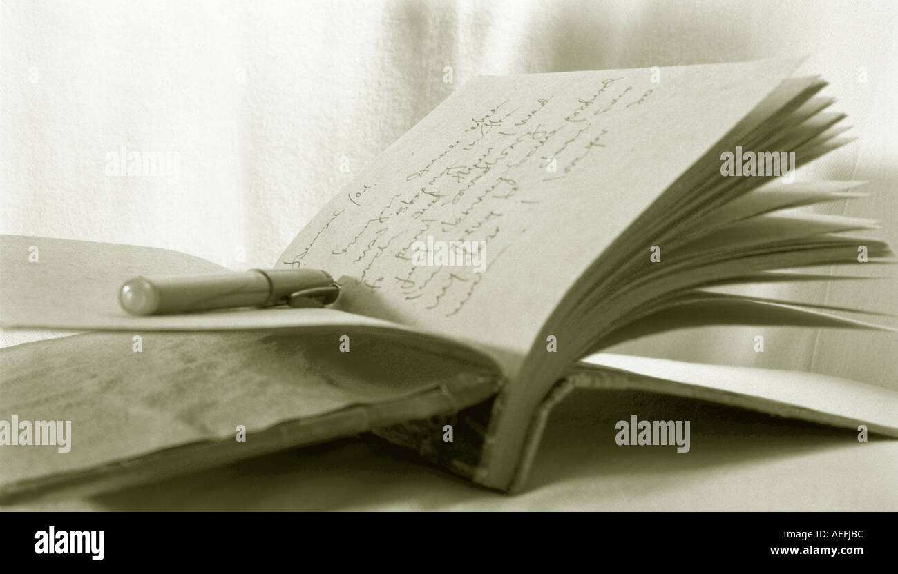 Writing inside open book Stock Photo - Alamy