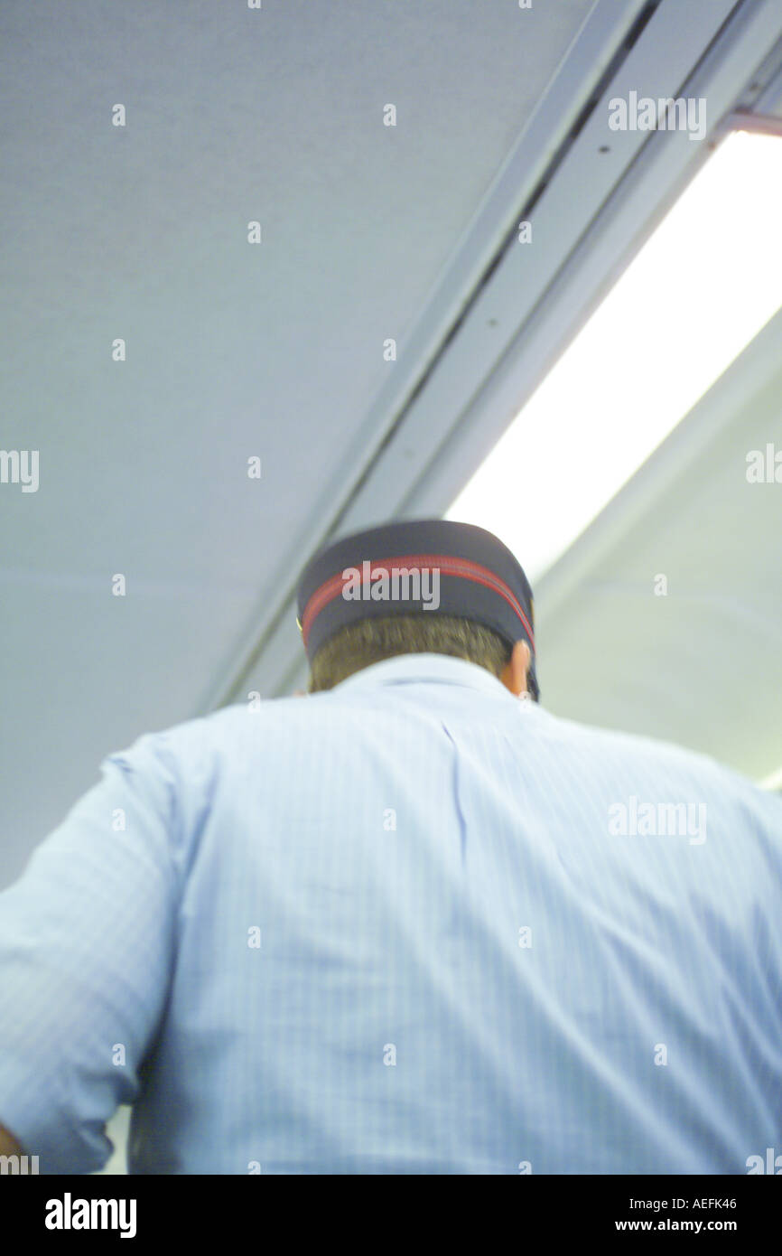 Conductor on a train Stock Photo - Alamy