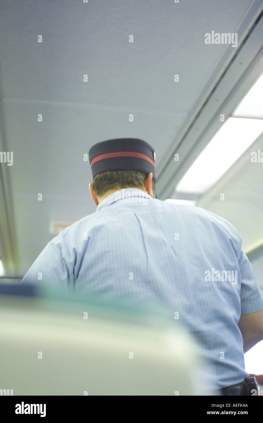 Conductor on a train Stock Photo - Alamy