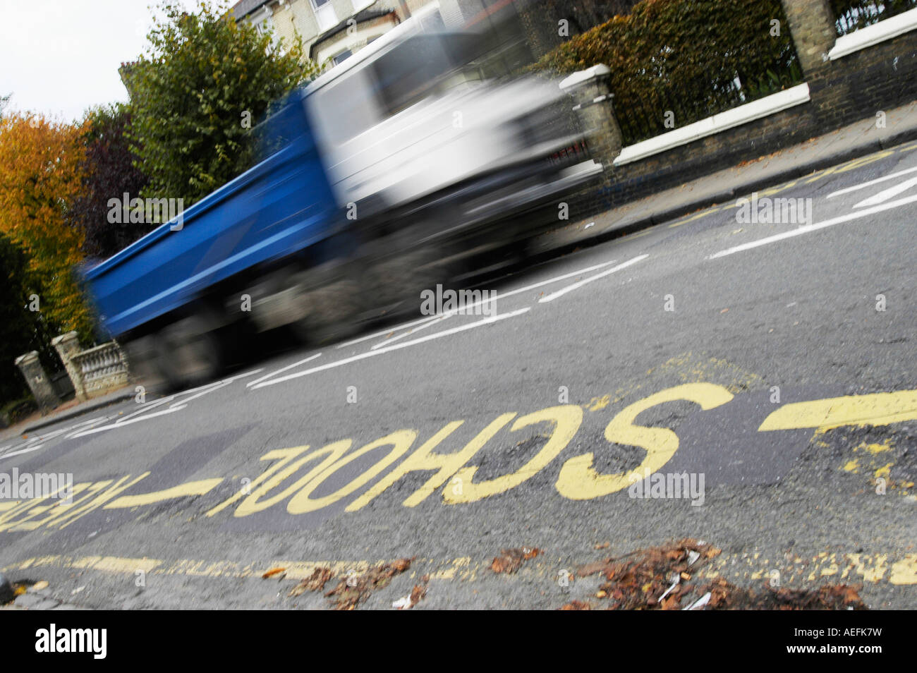 Lories roar past a school in SOuth London unaffected by the speed bumps ...