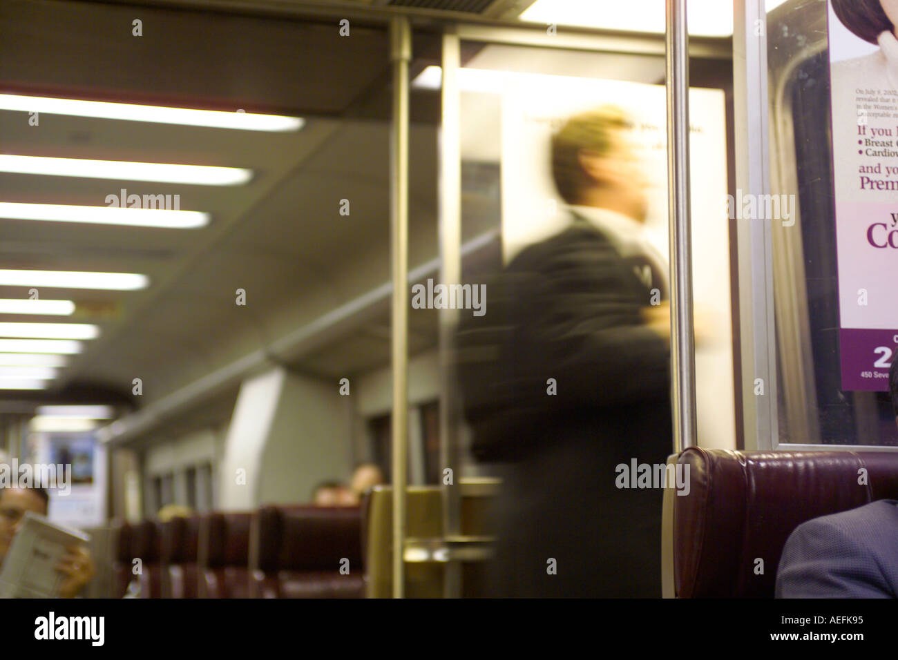Man exiting commuter train Stock Photo - Alamy