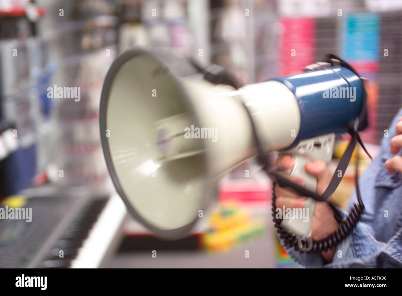 Hand holding megaphone Stock Photo - Alamy