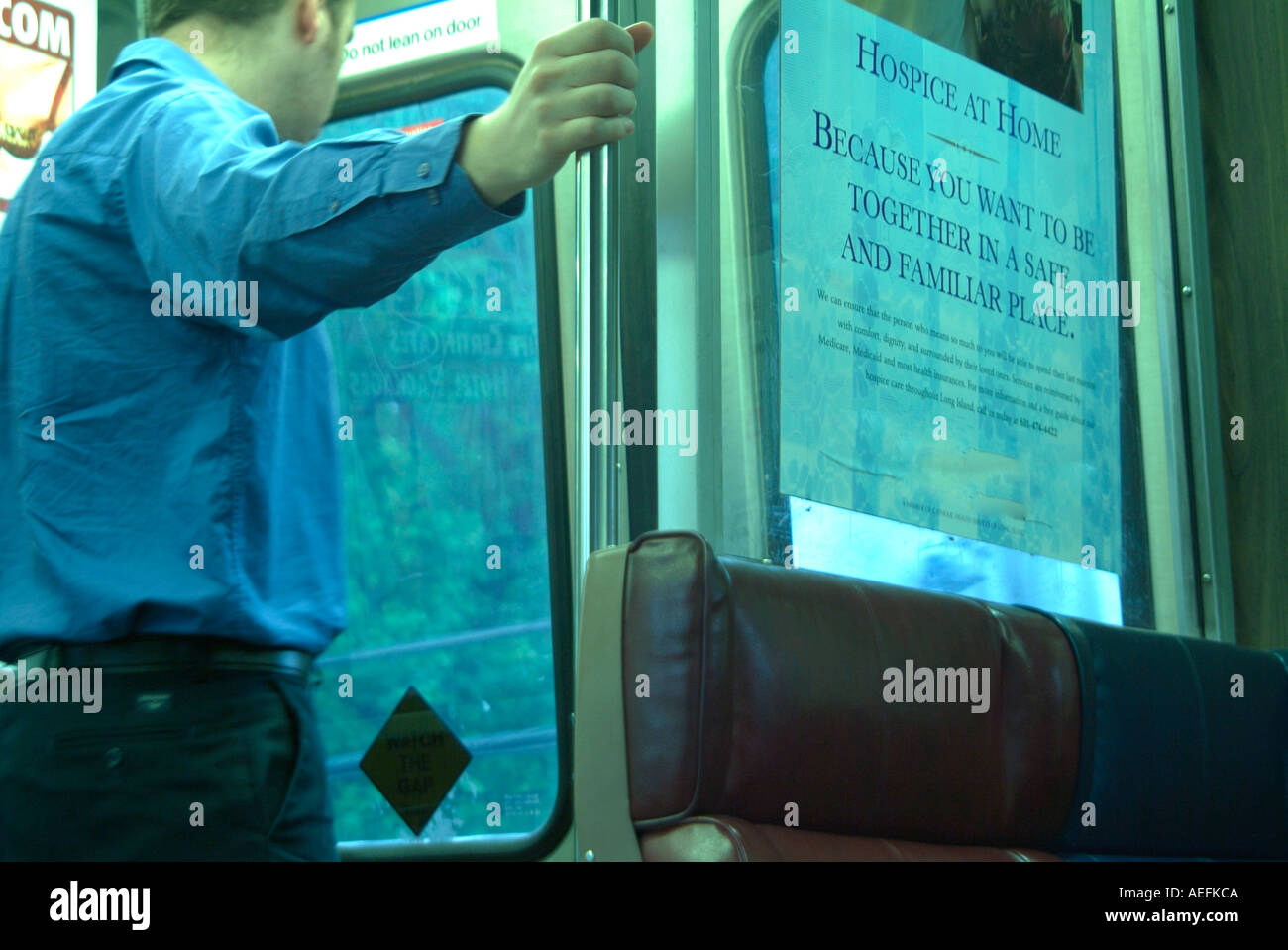 Man exiting commuter train Stock Photo - Alamy