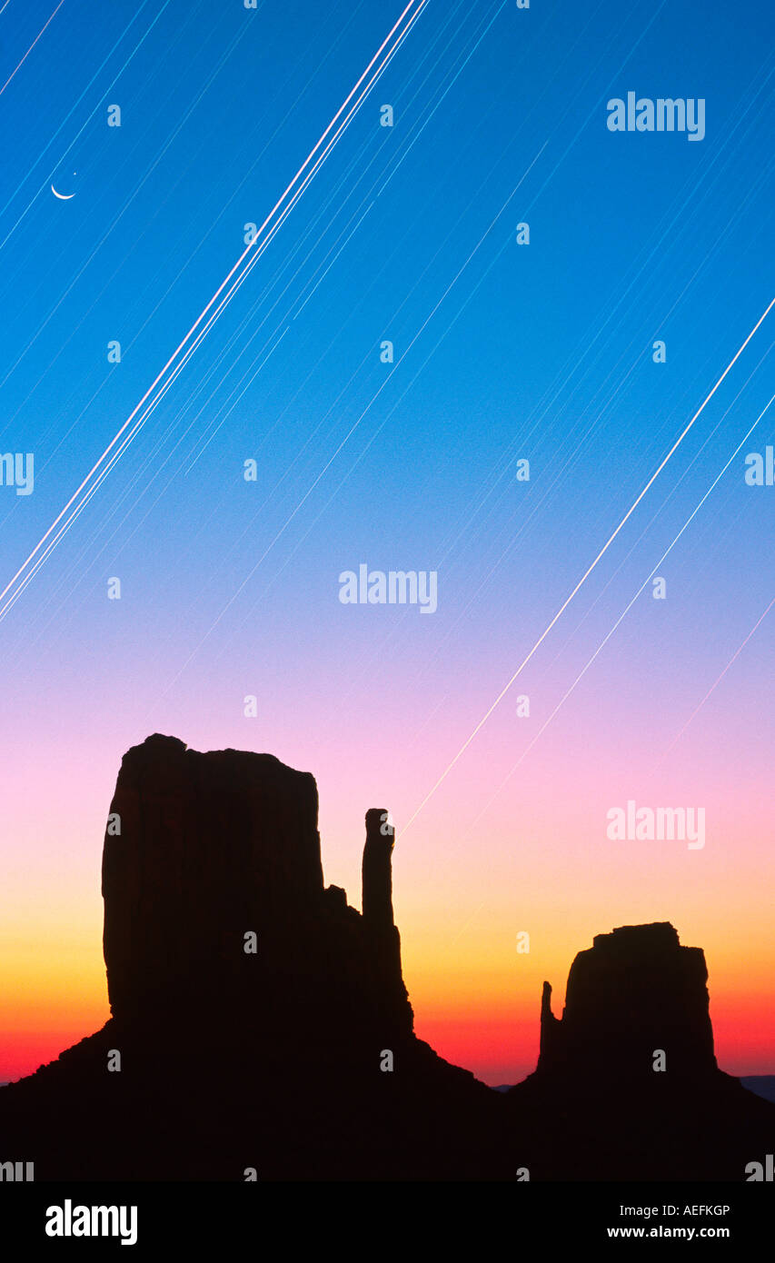 A crescent moon and Venus, with star tracks and morning pre-dawn glow ...