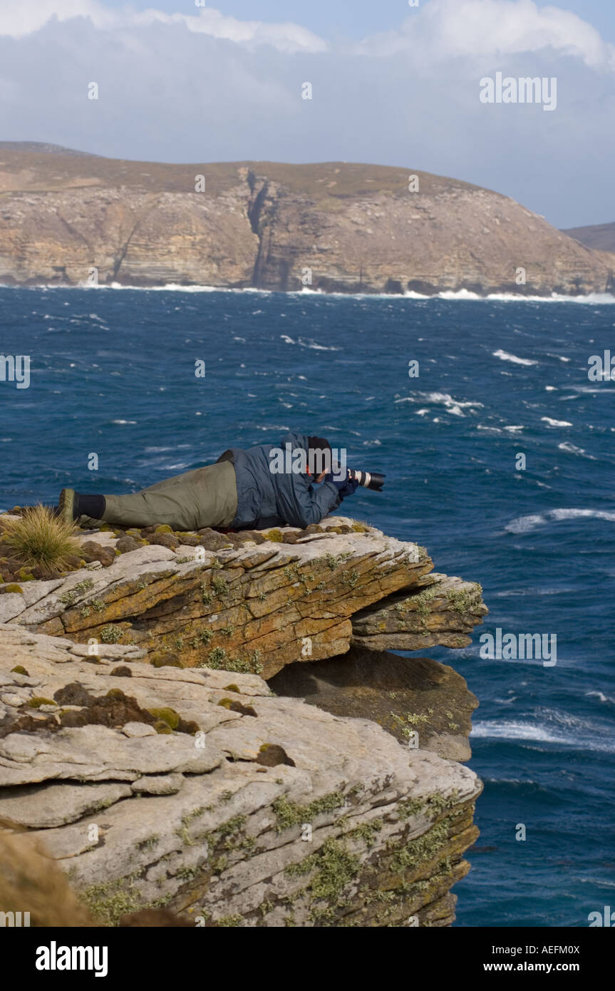 photographer John Eastcott along the coast of Beaver Island Falkland ...