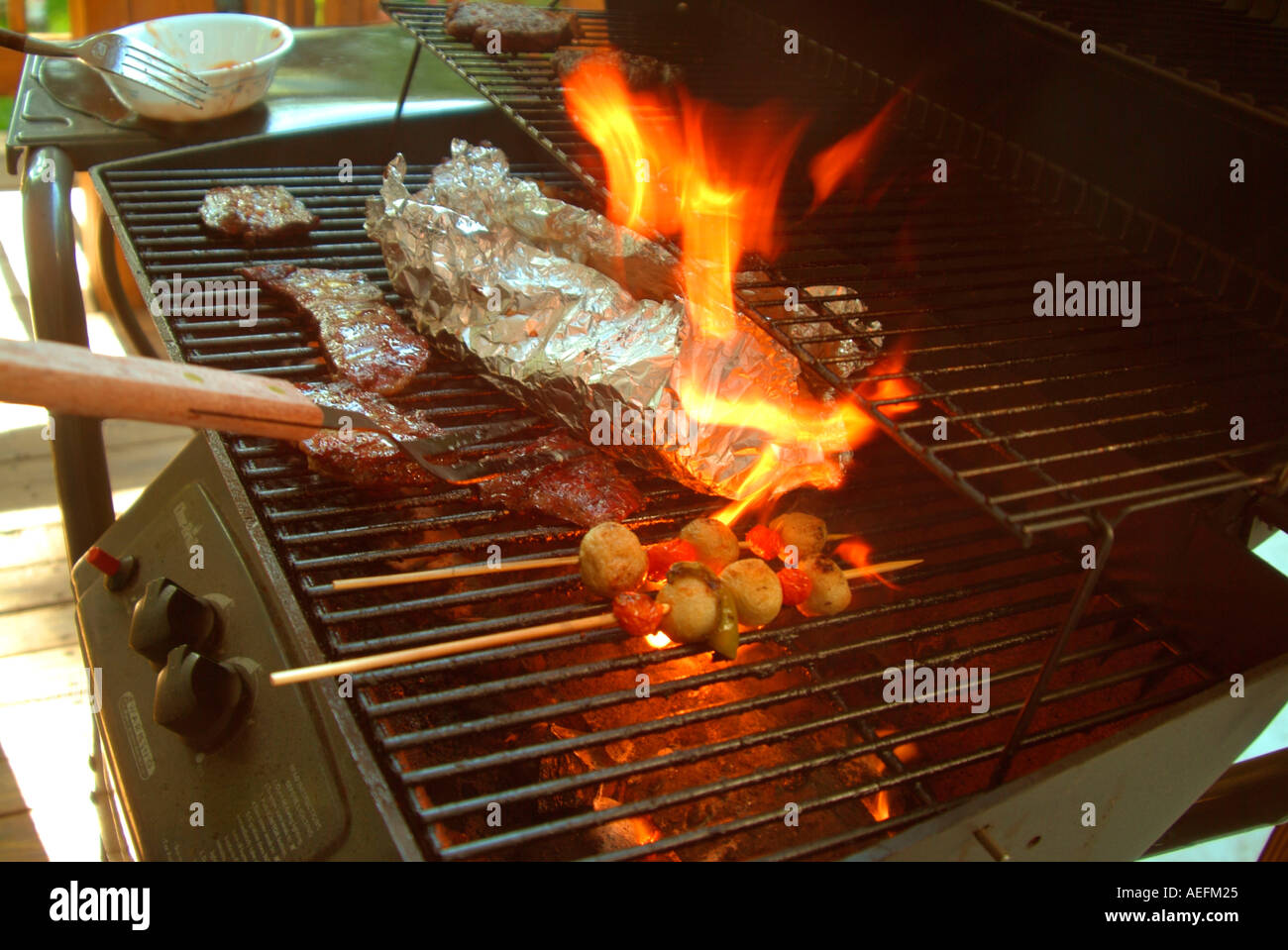 Food being cooked on barbecue grill Stock Photo - Alamy